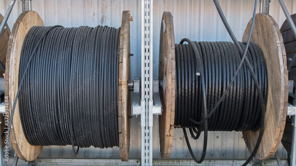 Hanging on perforated metal racks with crossbars are two large wooden ...