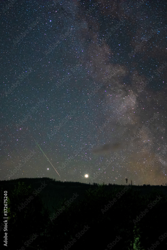 Foto de Stock Meteor or falling star over the mountains of the Alps ...