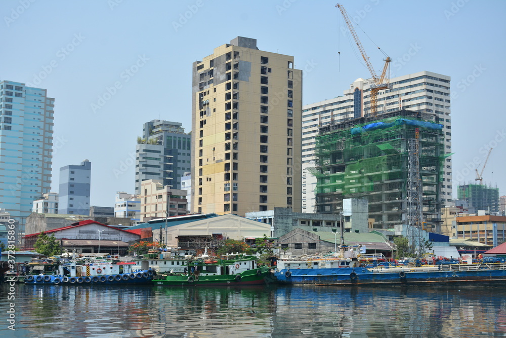 Neighboring buildings cityscape at Pasig river in Manila, Philippines ...