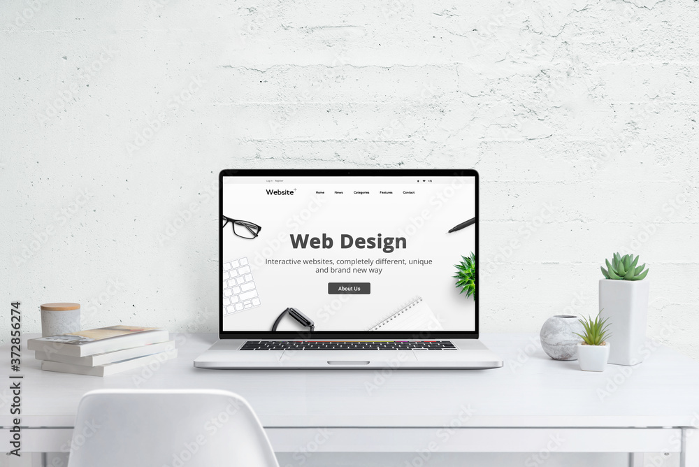 Web design studio creative concept. Modern laptop computer with company ...