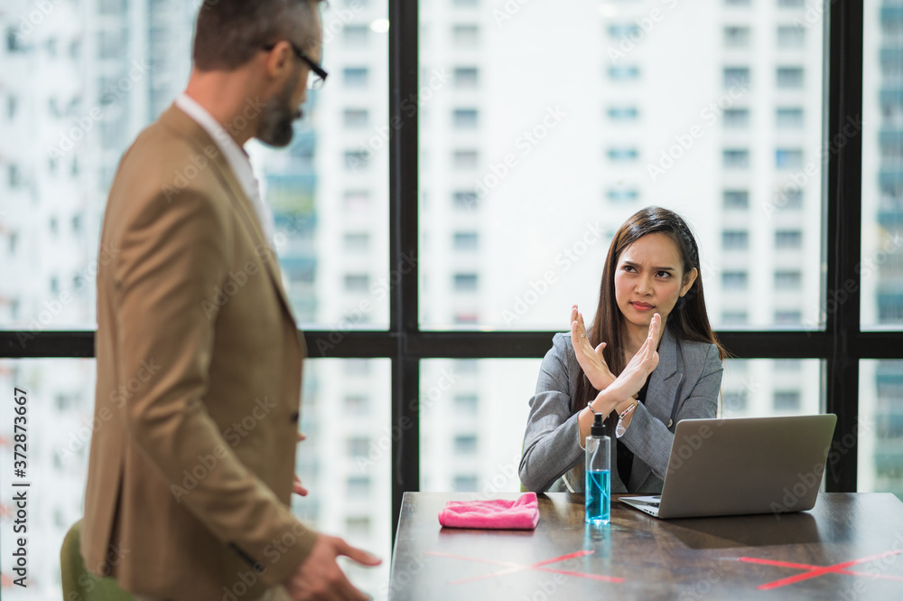 Young asian business woman forced young businessmen to sit with Because ...