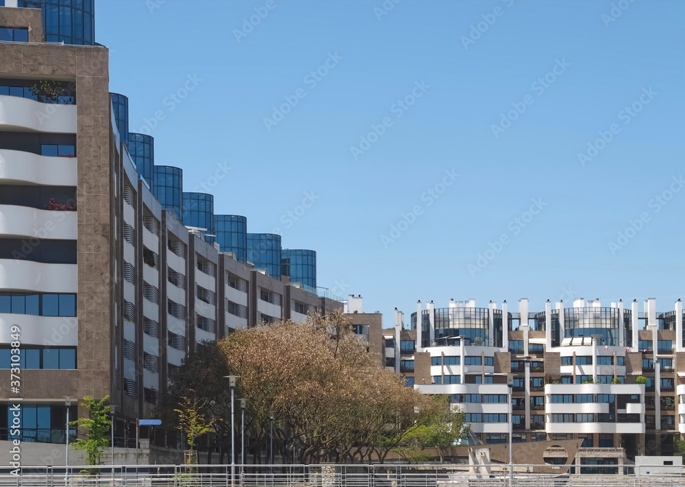 Walking the footpath Passeio do Tejo along Tagus river in Lisbon at the ...