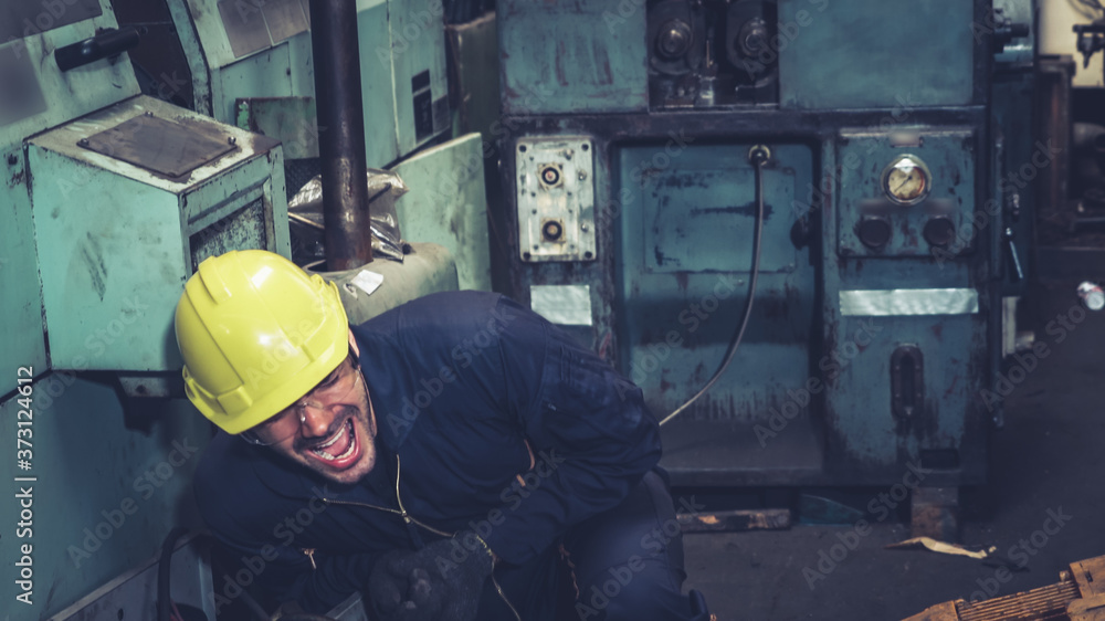 Foto de Stock Factory worker injured by accident while using machine in ...