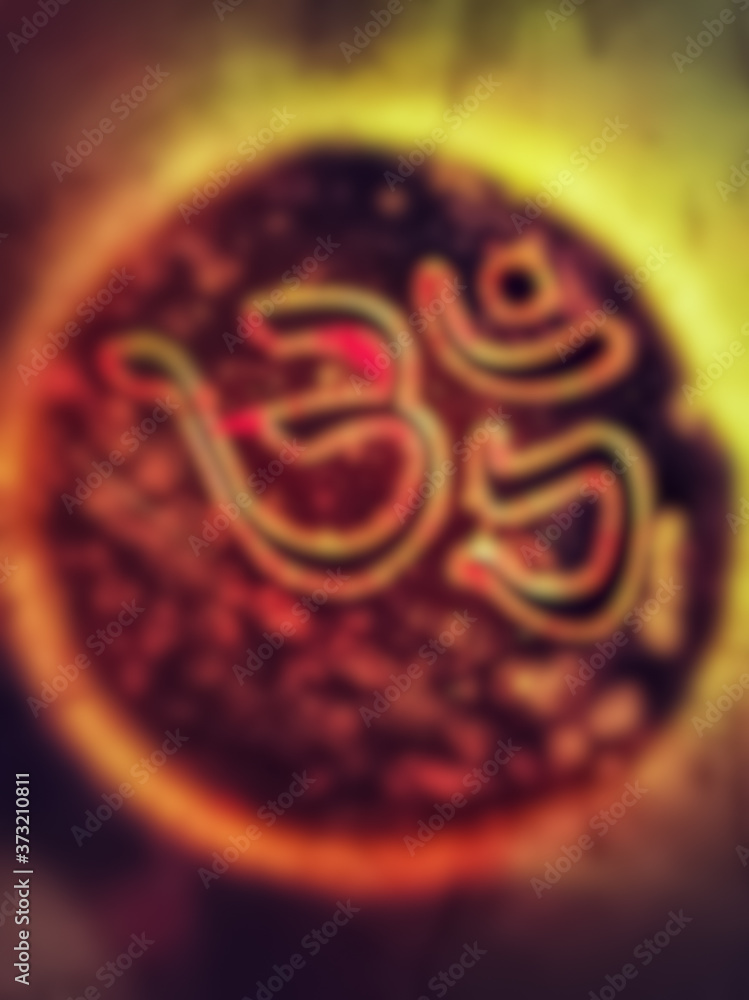 'Aum' is the symbol of hindu god lord Shiva. Also 'AUM' is chants of ...