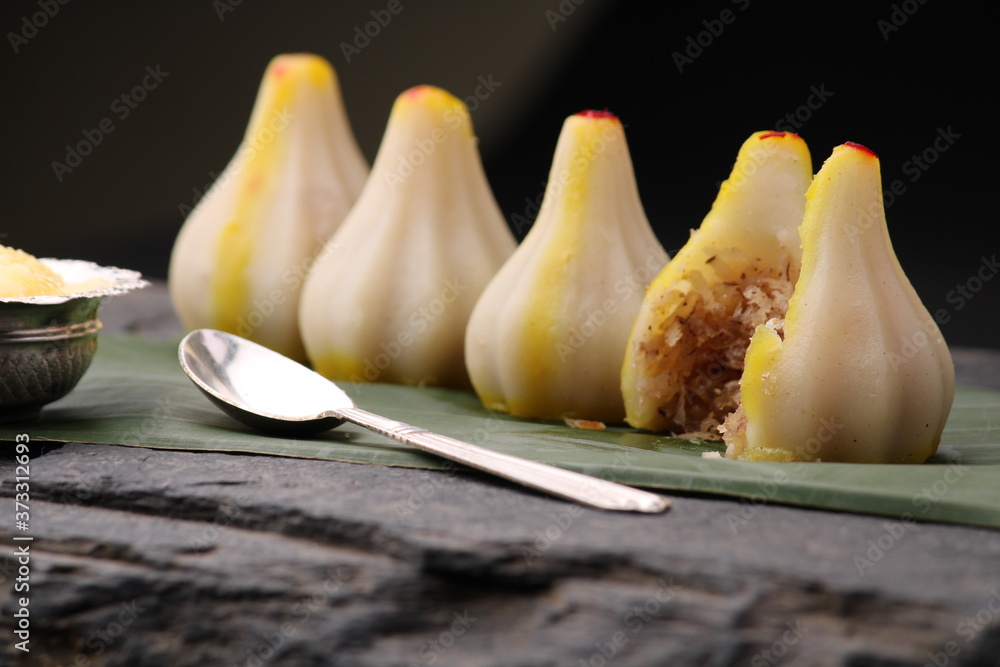 Modak- a traditional dish made on Ganpati festival in India. Served ...