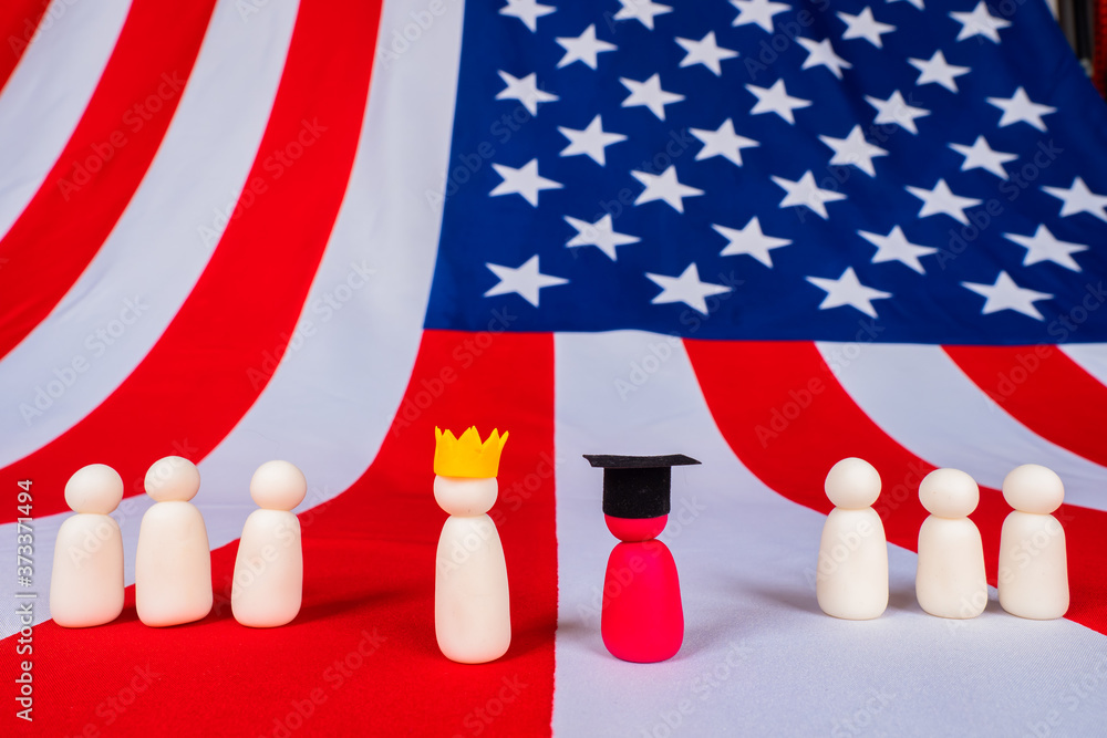 Fotografie Miniature men onbackground of USA flag. Concept - US ...