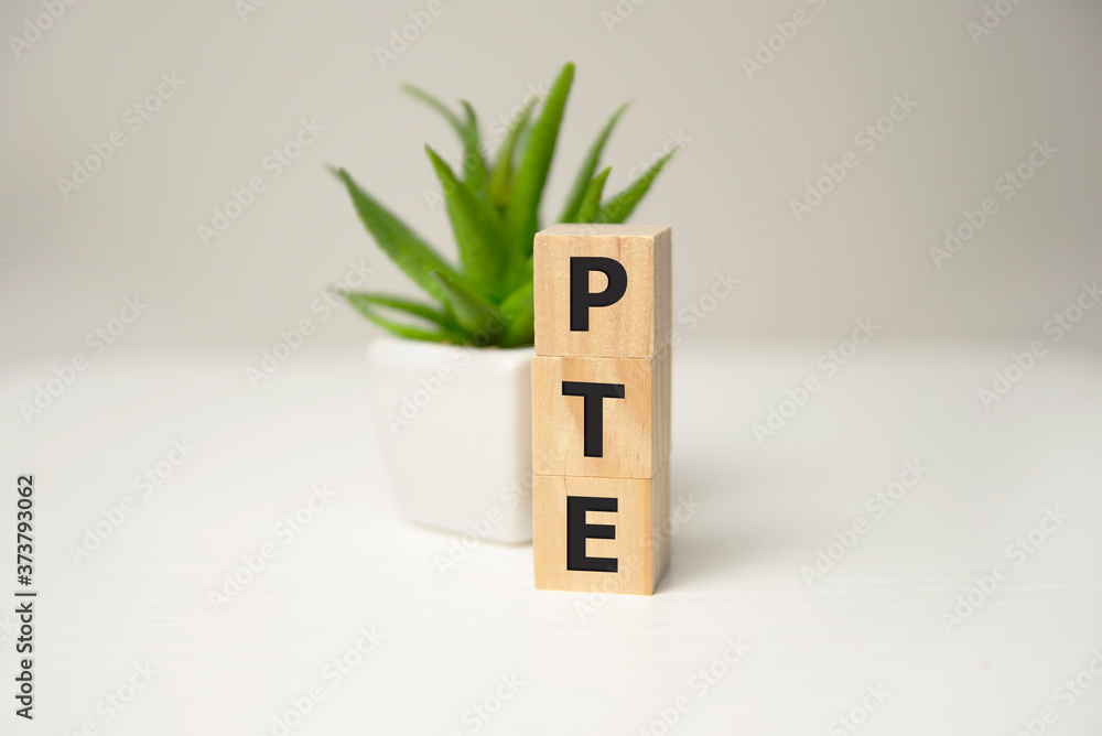 PTE - acronym from wooden blocks with letters, Pearson Tests of English ...
