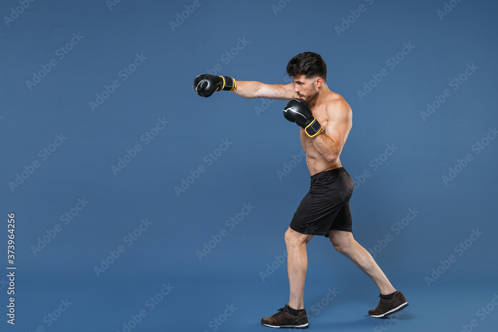 Full length portrait side view of fitness guy bare-chested muscular ...