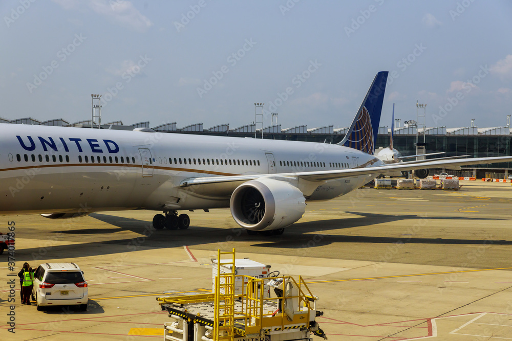 United Airlines airplanes on the terminal C gate of getting ready for ...