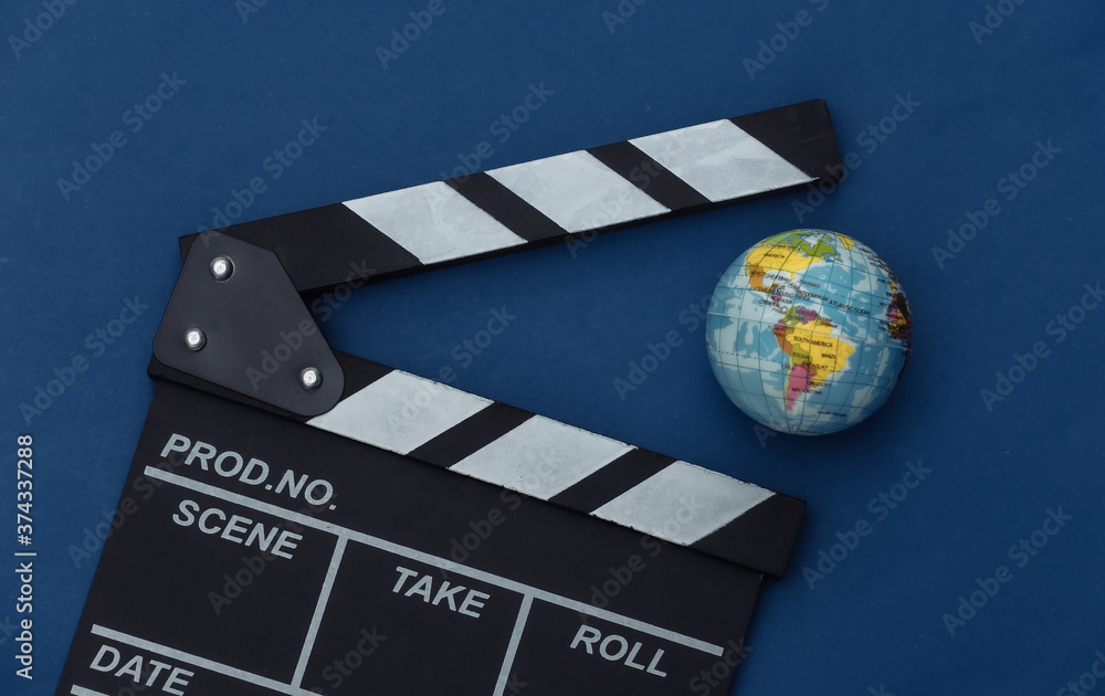 Movie clapper board with globe on classic blue background. Filmmaking ...