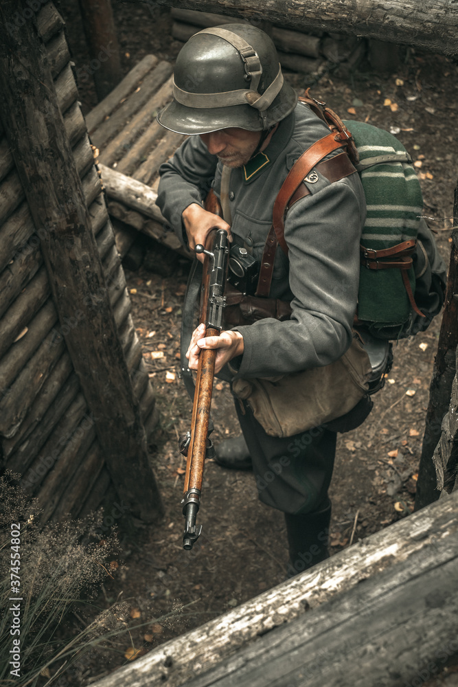 A soldier in the uniform of the Finnish army of world war II with a ...