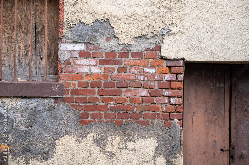 brick wall where the plaster crumbles down, as a sign of decay Stock ...