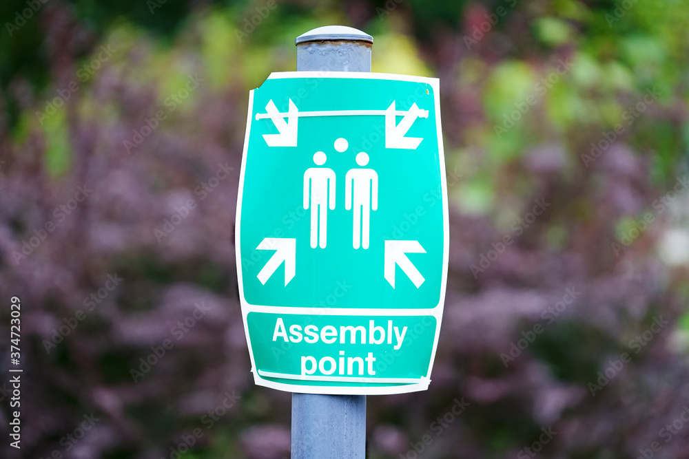 Fire assembly point sign at workplace signpost Stock Photo | Adobe Stock
