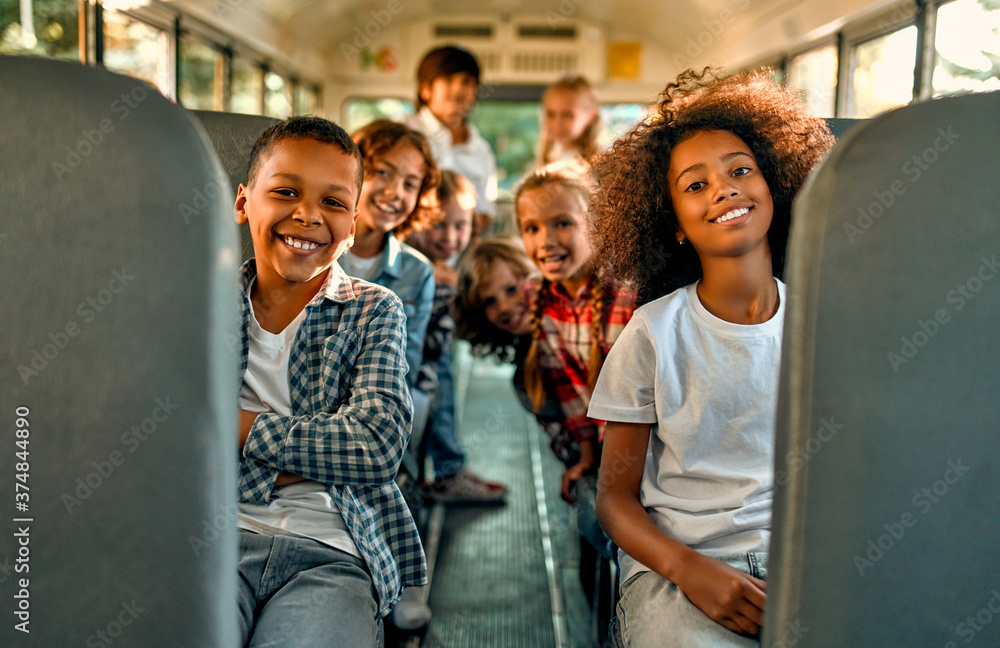 Children in school bus Stock Photo | Adobe Stock