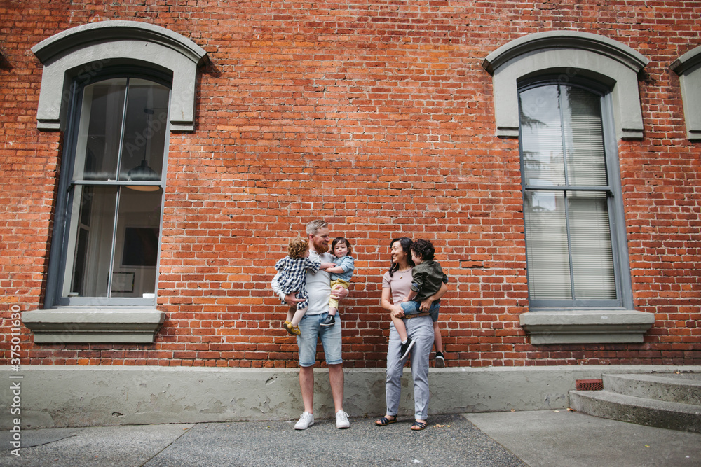 Fun loving family of five hanging out together in the city. Stock Photo ...