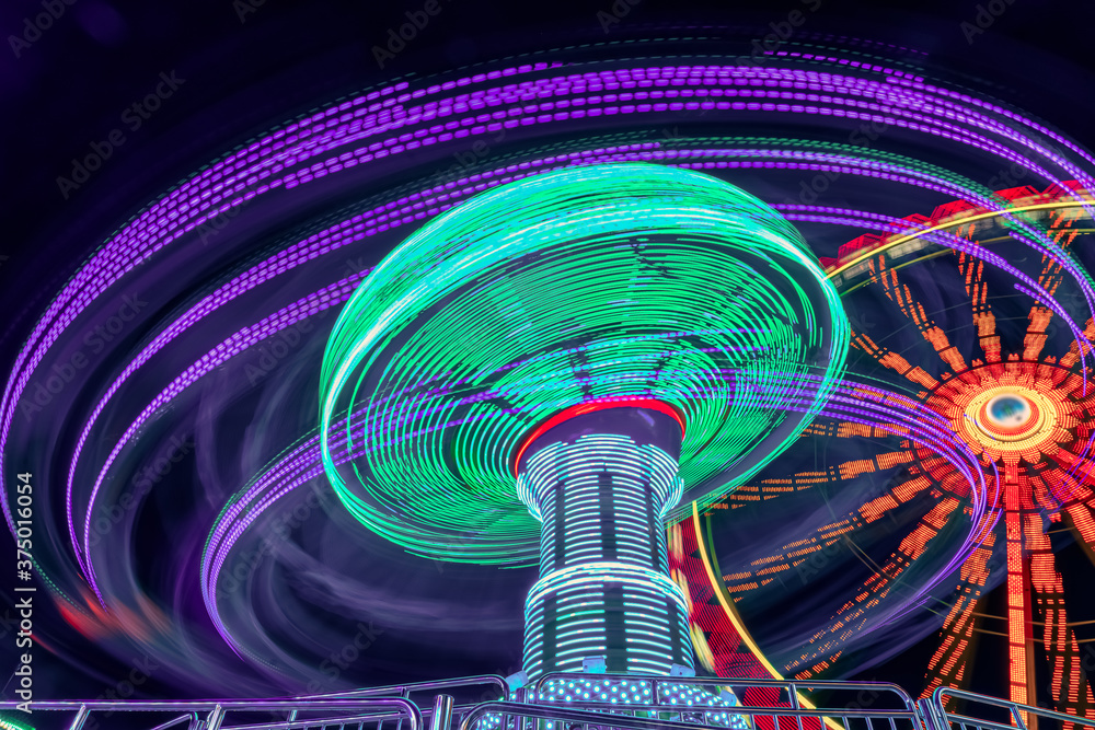 Fun for teens and family. A long exposure of a amusement park with a ...