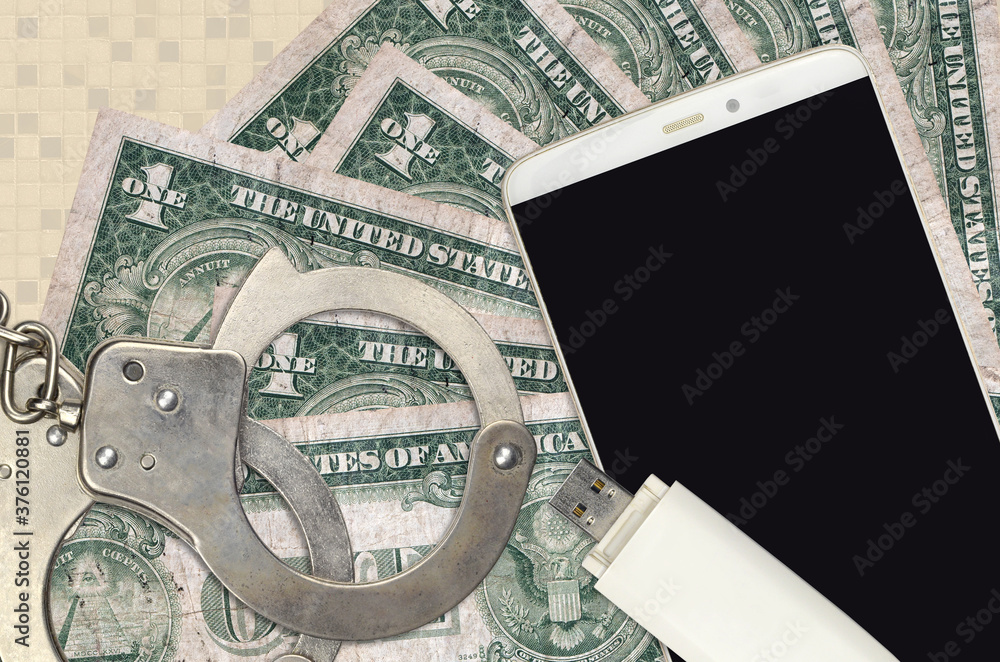 1 US dollar bills and smartphone with police handcuffs. Concept of ...