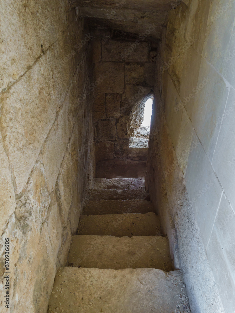 Corridor with stairs between levels inside medieval tower of fortress ...