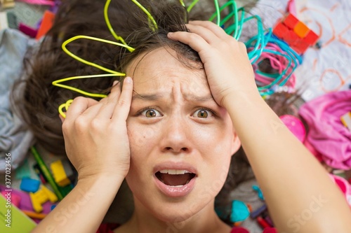 Stressed out busy mom at home, messy home. - Stock Image - Everypixel