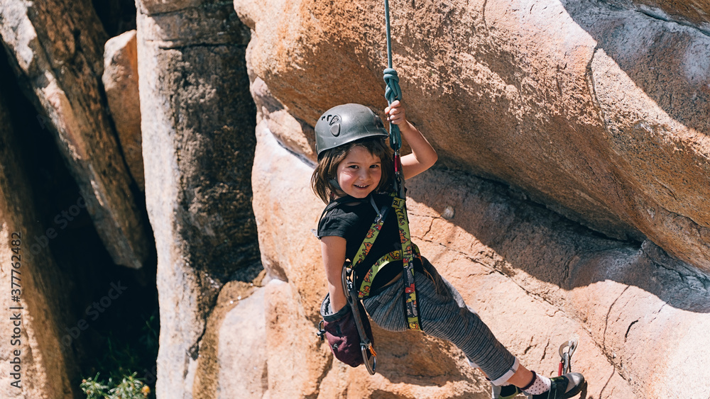 Smiley Little Girl Doing Rock Climbing Stock Photo | Adobe Stock