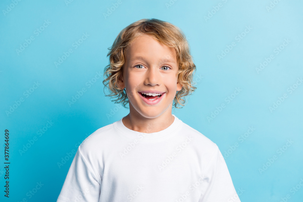 Portrait of positive boy look in camera excited wear white t-shirt ...