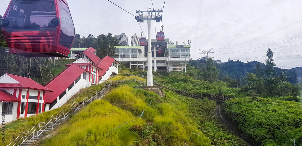 cable car at genting highlands, malaysia in a foggy weather with green ...