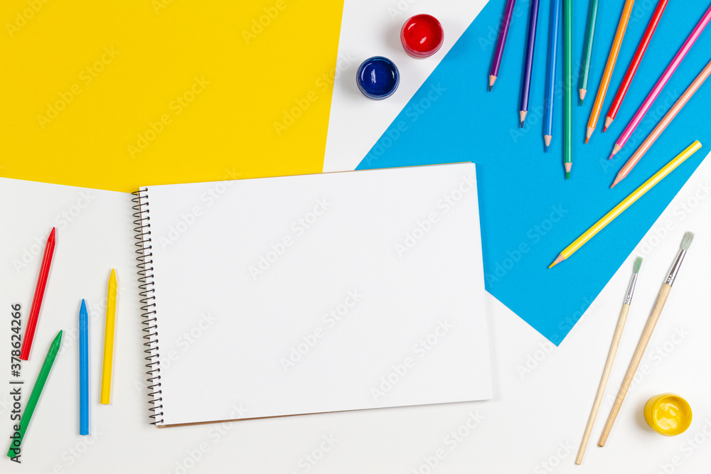 Learning, hobby, art background. Empty sketchbook with art supplies ...