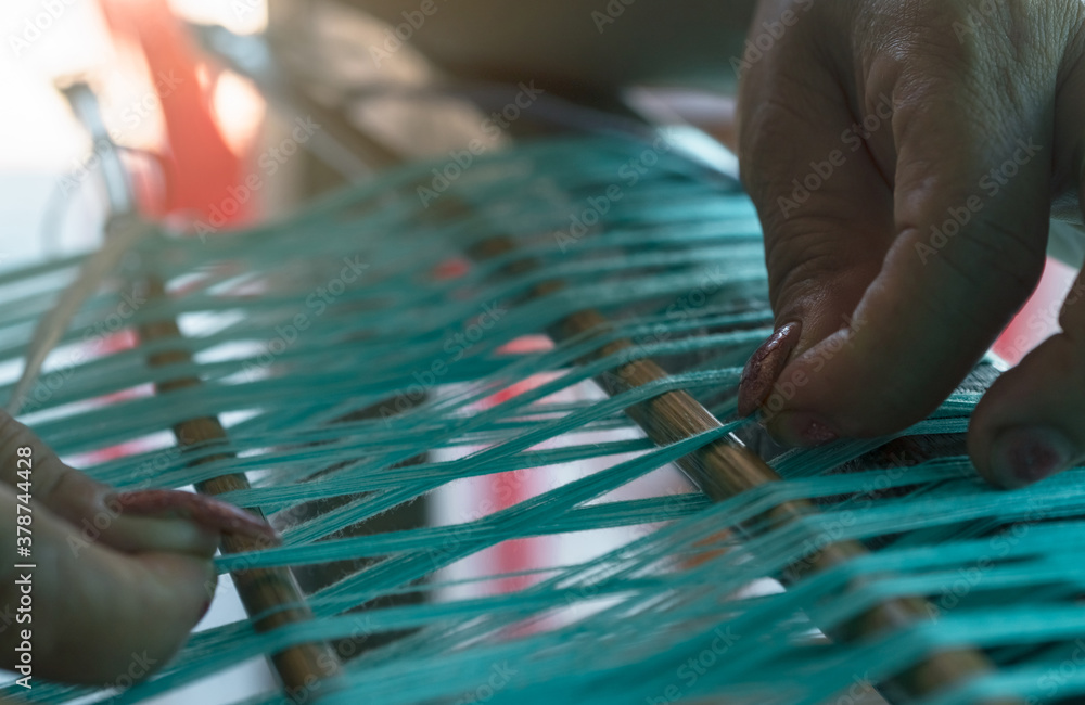 Woman working on weaving machine for weave handmade fabric. Textile ...