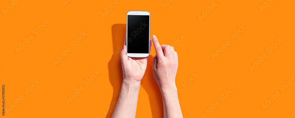 Person using a white smartphone from above Stock Photo | Adobe Stock