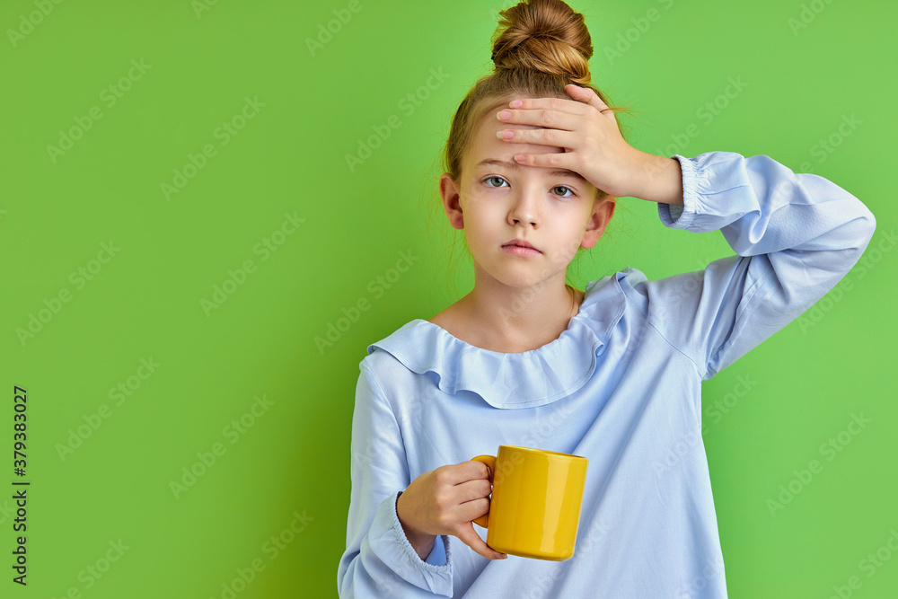 serious kid girl has headache in the morning before going to school ...