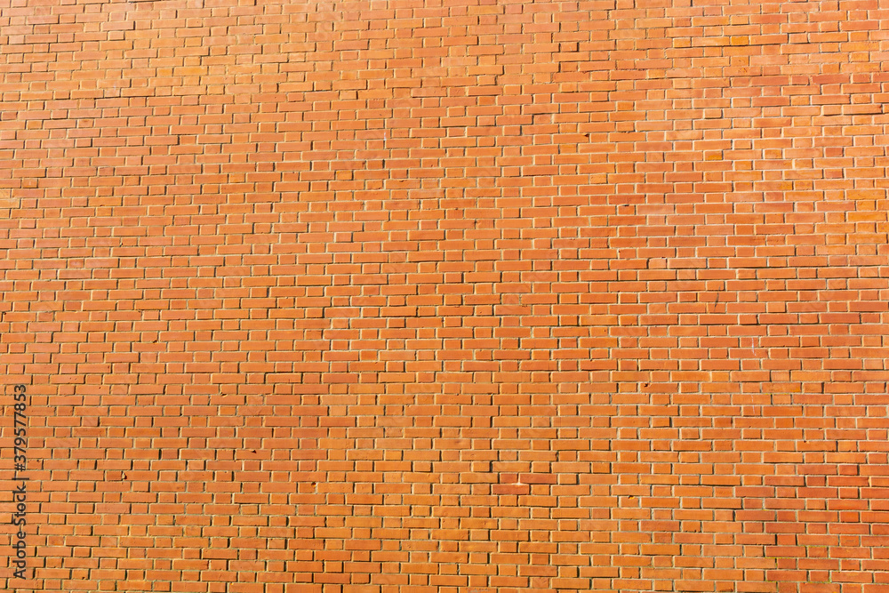 Orange bricks wall texture background. Structure of small stones ...