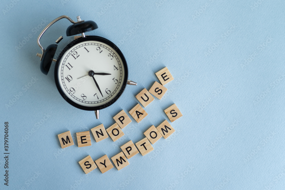 Concept. The inscription from the letters menopause. Symptoms of ...