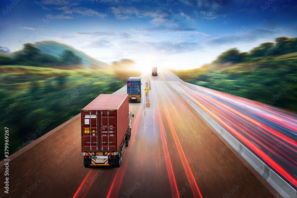 Truck transport with red container on highway road at sunset, motion ...