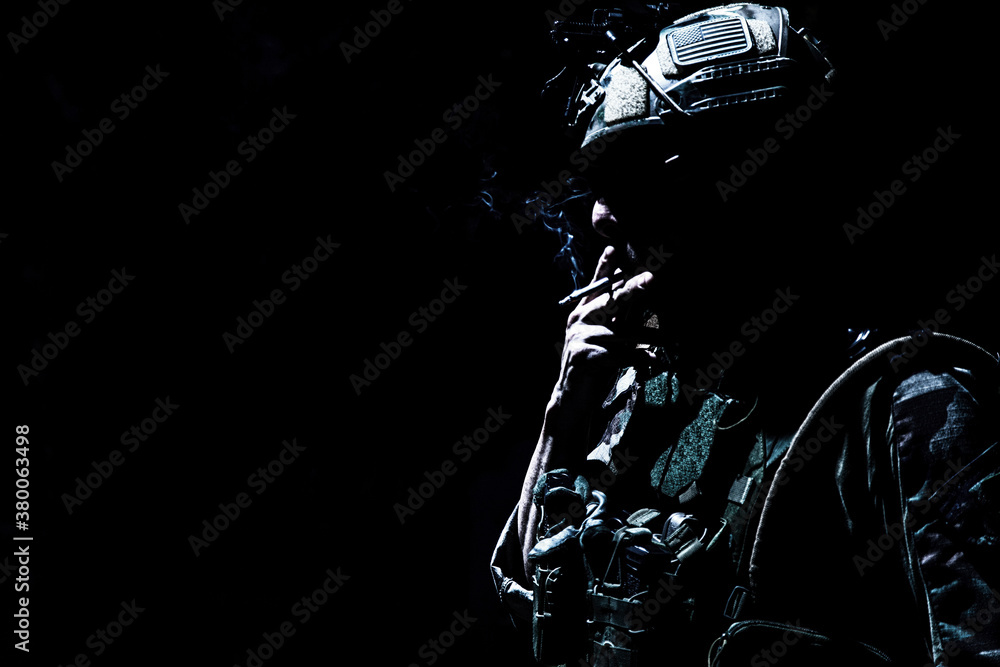 Foto de Stock Army soldier in combat uniform and helmet, smoking ...