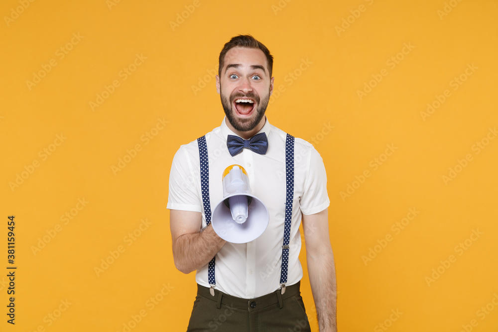 Surprised excited young bearded man 20s wearing white shirt bow-tie ...