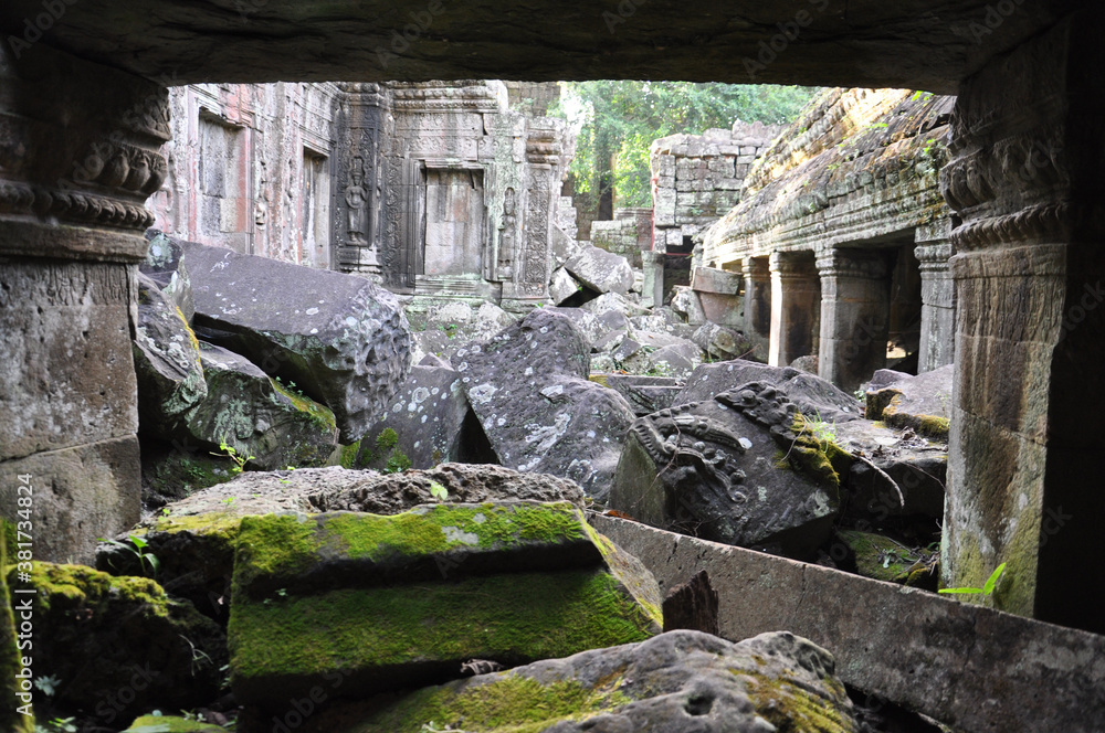 Stone rubble and ruins at the ancient Khmer temples of Angkor Wat, in ...