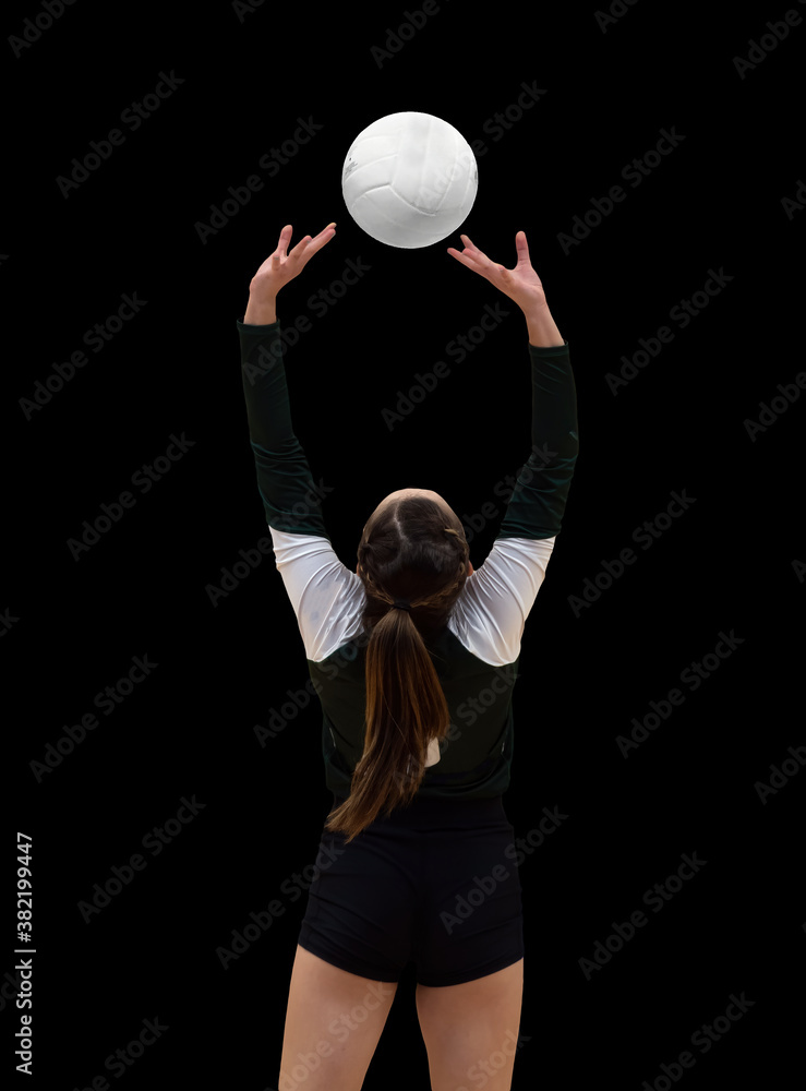 Young girl playing in a competitive volleyball match Stock Photo ...