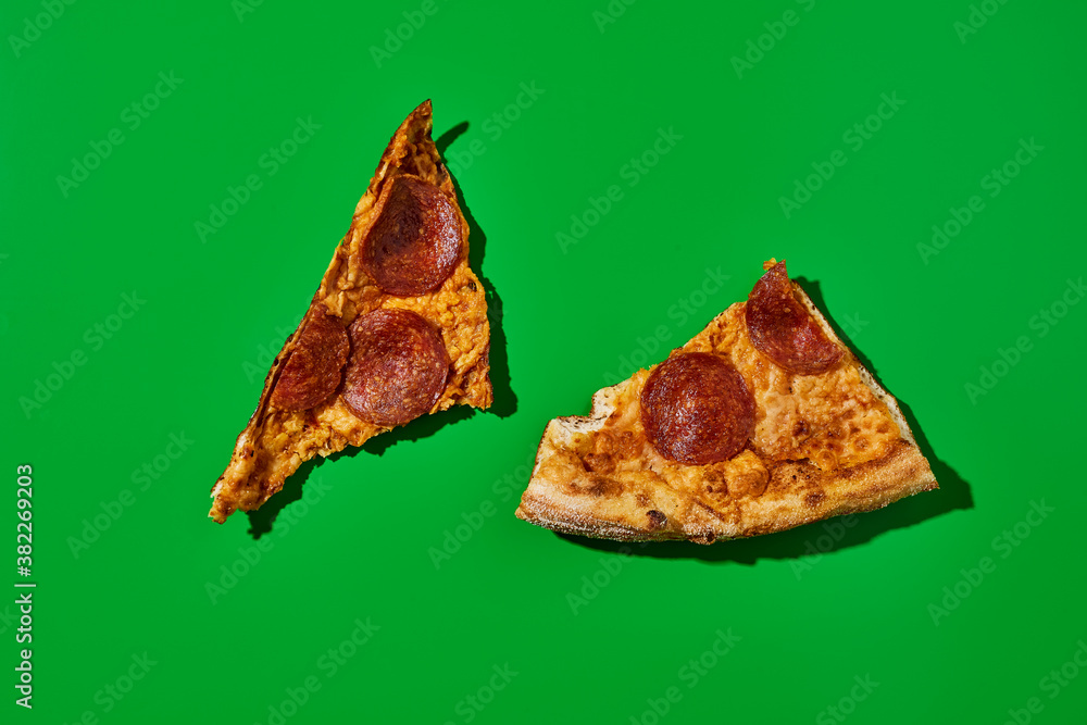 broken slice of pepperoni pizza Stock Photo | Adobe Stock