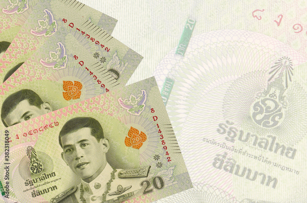 20 Thai Baht bills lies in stack on background of big semi-transparent ...