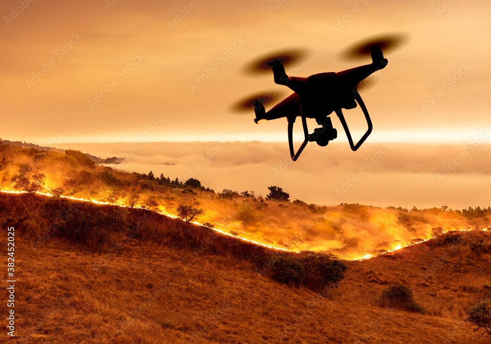 Drone flying over wildfire or forest fire on California coast Stock ...