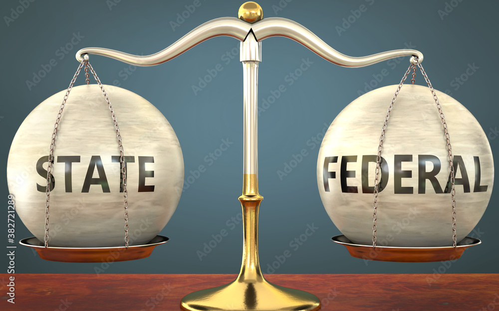 state and federal staying in balance - pictured as a metal scale with ...