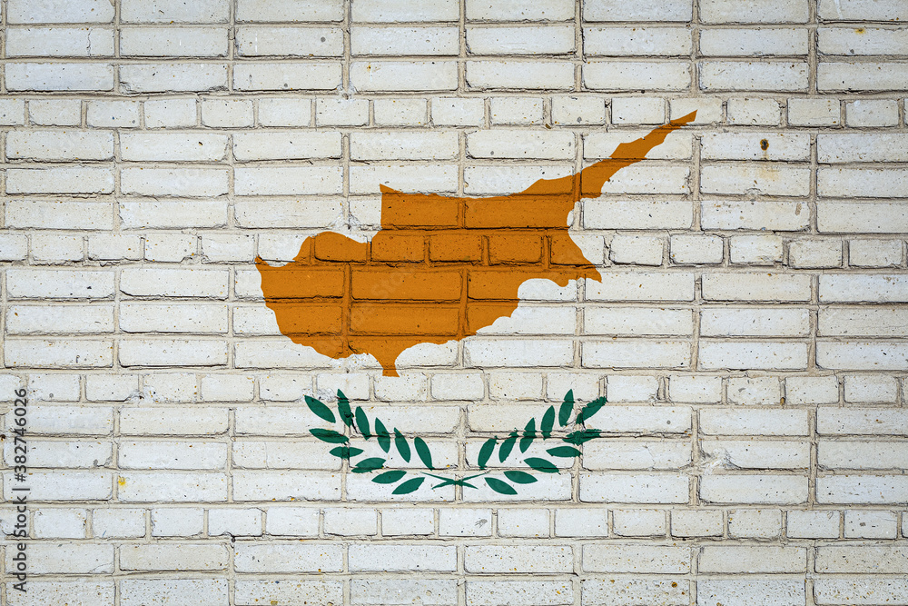 National flag of Cyprus depicting in paint colors on an old brick wall ...