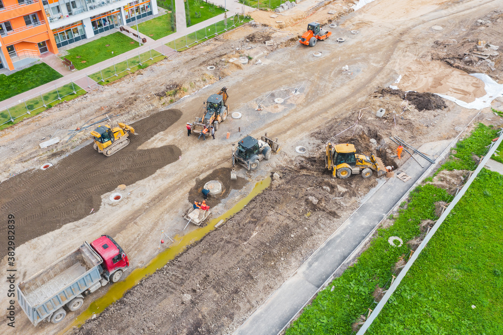 Construction of a city street, laying of communications, installation ...