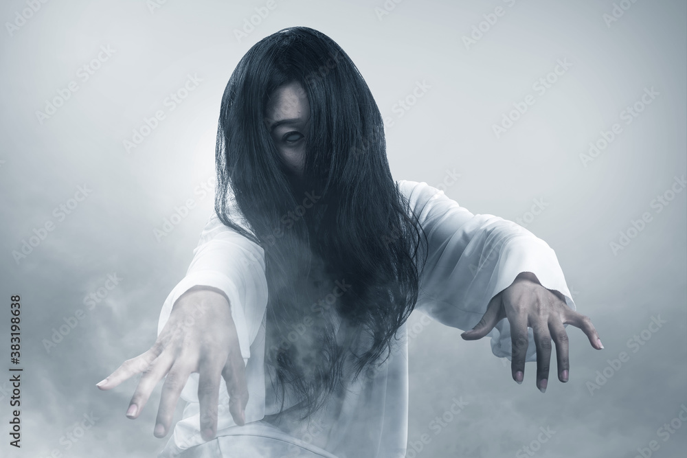Scary ghost woman crawling in the fog Stock Photo | Adobe Stock