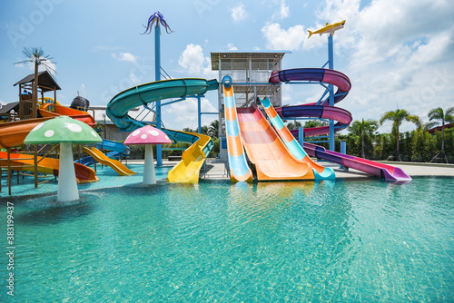 water park slide with swimming pool at amusement park colored plastic ...