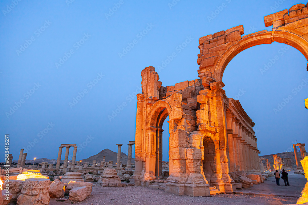 landscape image of the ancient city of Palmyra at night right before ...