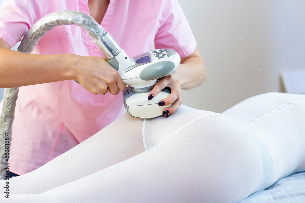 Beautiful woman getting beauty therapy against cellulite with LPG ...