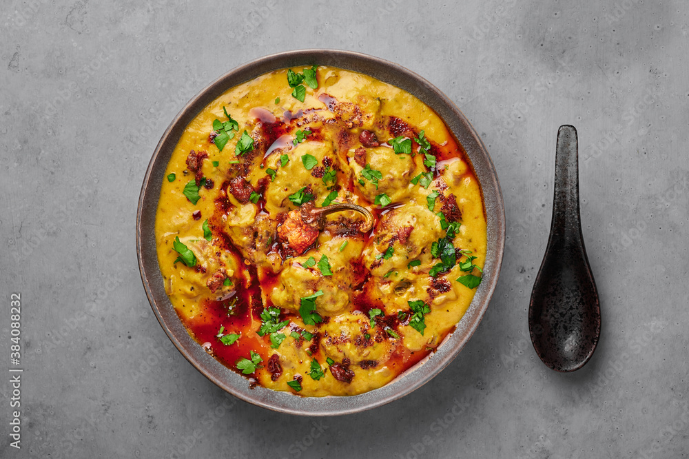 Punjabi Kadhi Pakora in gray bowl on concrete table top. Kadhi Pakoda ...