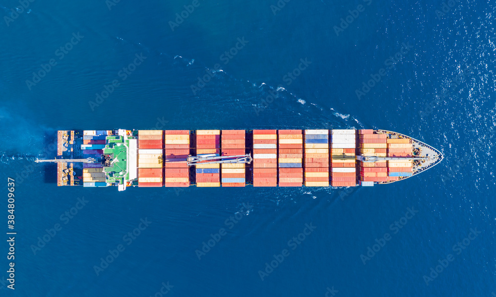 Cargo ship full loaded with containers, blue sea background, top view ...
