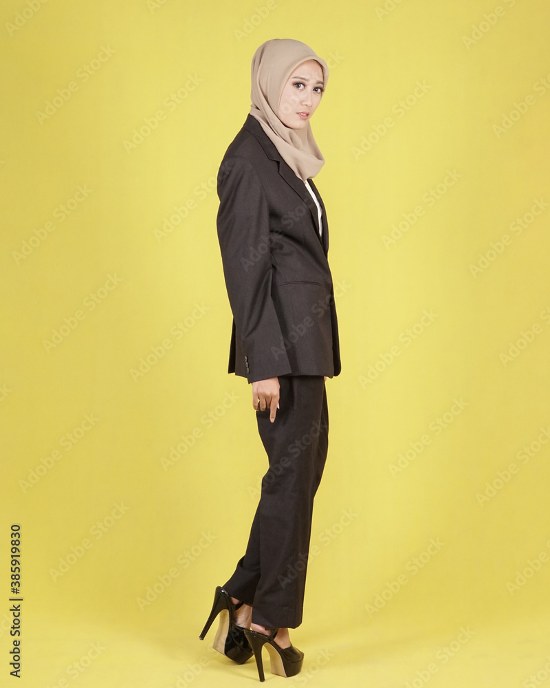 Hijab female models pose like famous models. The woman is wearing a set ...